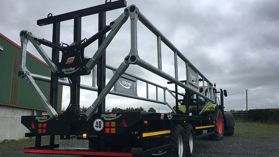 Round bale trailer simplifies collection process - Farmers Weekly