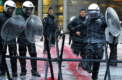 PHOTOS: Dairy farmers spray milk in Brussels protest - Farmers Weekly