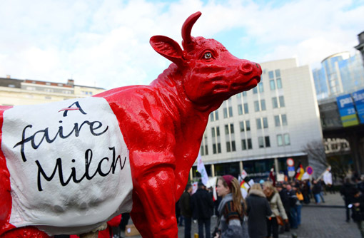 PHOTOS: Dairy farmers spray milk in Brussels protest - Farmers Weekly